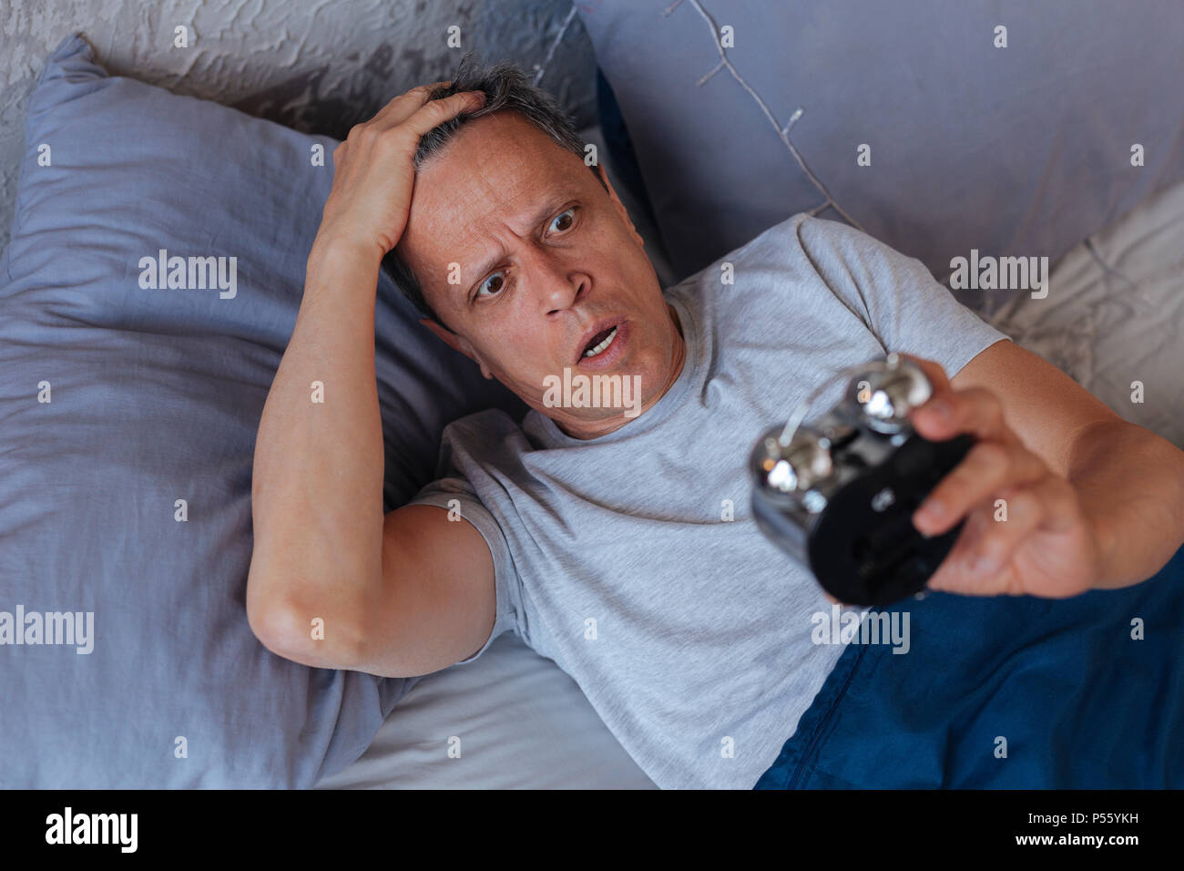 Shocked mature man realizing time Stock Photo - Alamy