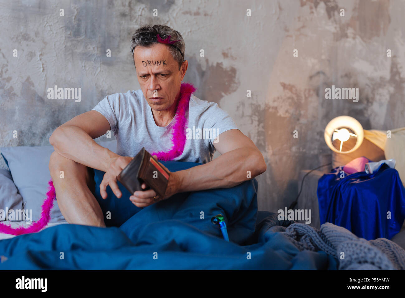 Focused mature man parting money Stock Photo - Alamy