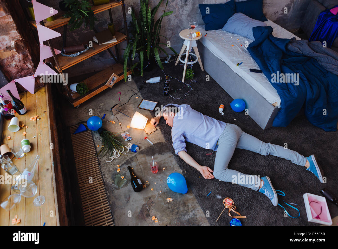 Drunk mature man misapplying alcohol Stock Photo - Alamy