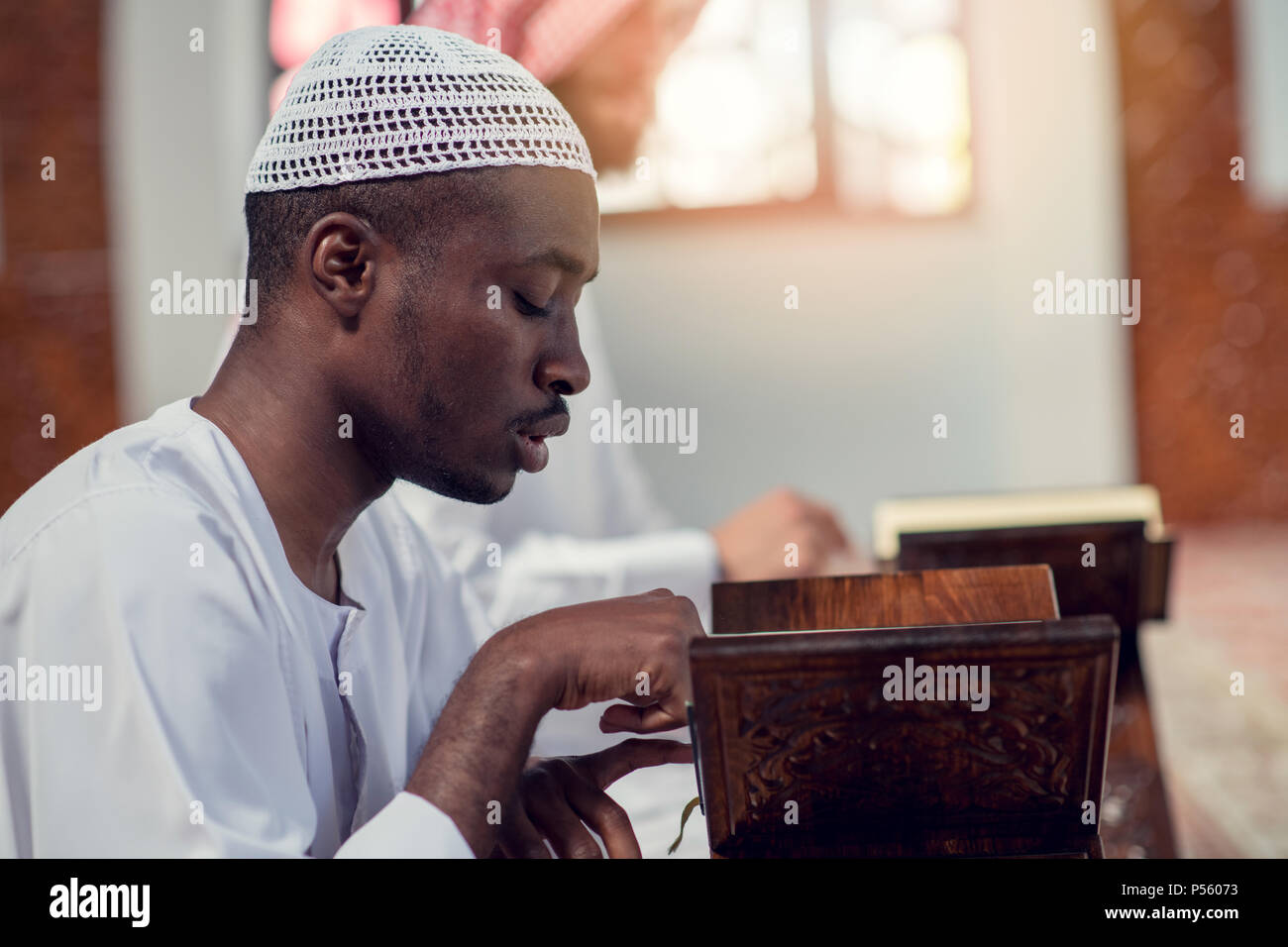 Two religious muslim man praying together inside the mosque Stock Photo ...