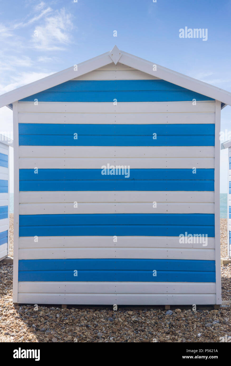 Blue and white striped beach huts at the seaside Stock Photo - Alamy