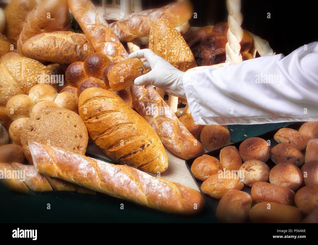 an image of variety of breads and chief Stock Photo - Alamy