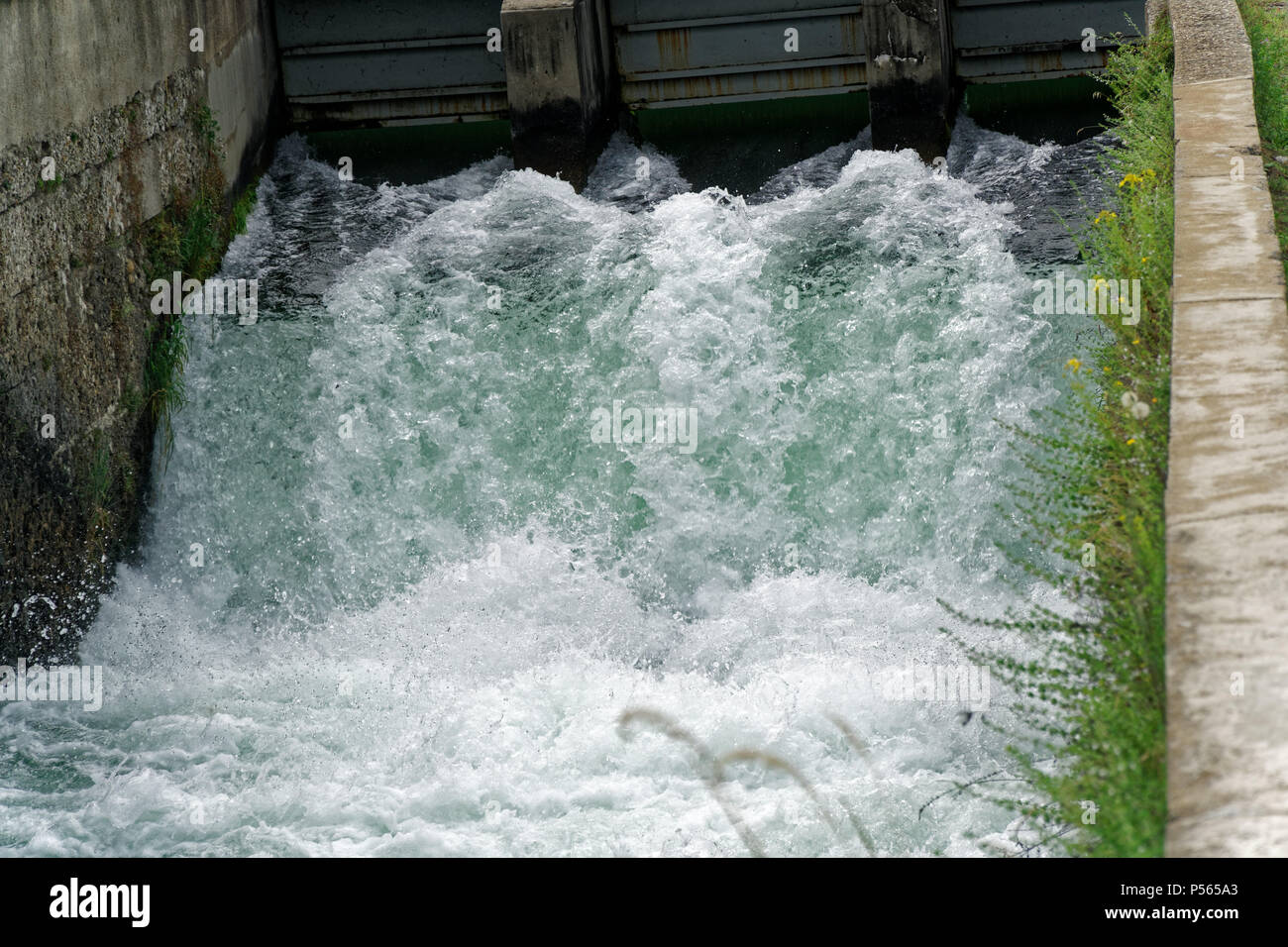 Artificial dam and waterfall use for field watering Stock Photo - Alamy