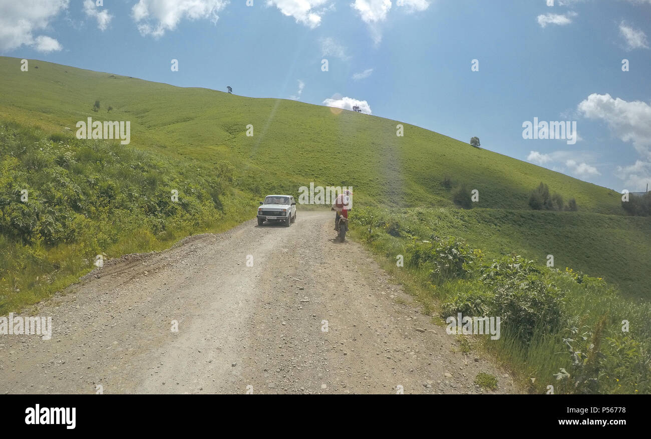 Bike speed journey in the mountains with the dirt bike Enduro in Caucasus Georgia Stock Photo ...