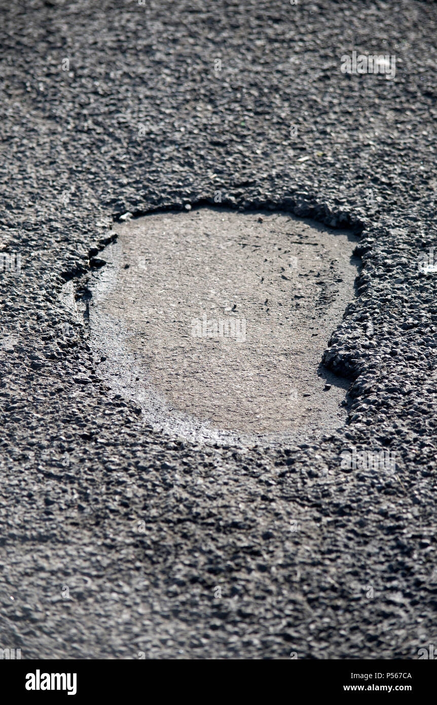 Pothole on road Stock Photo - Alamy