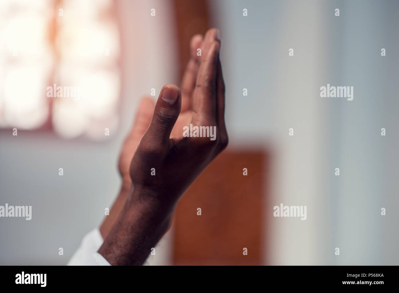 Hand of muslim black man people praying with mosque interior background ...