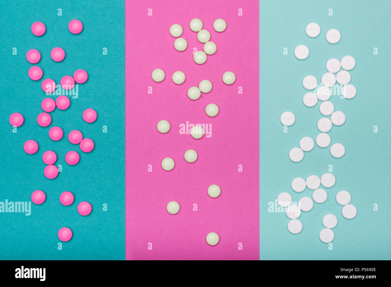 Assortment of various colourful pills isolated on pastel colored ...