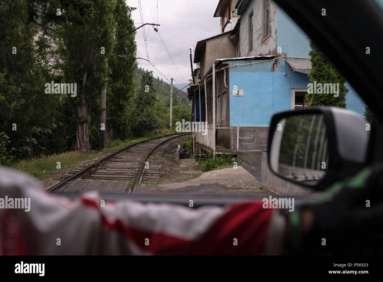 Road trip mirror view from the car on railroad Stock Photo - Alamy