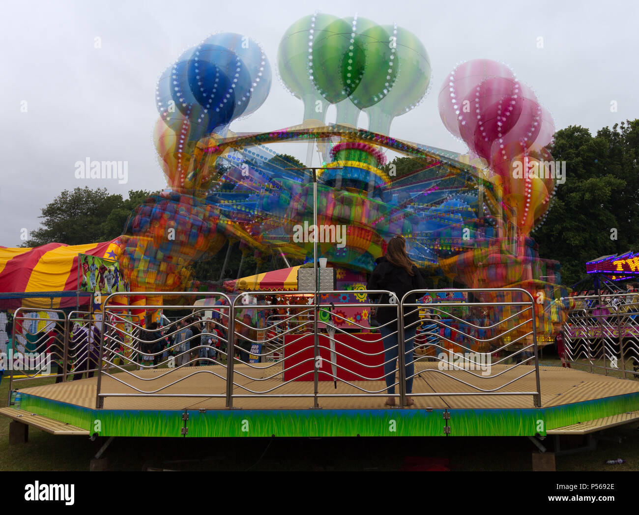 Multiple exposure of a fast fairground ride in motion Stock Photo - Alamy