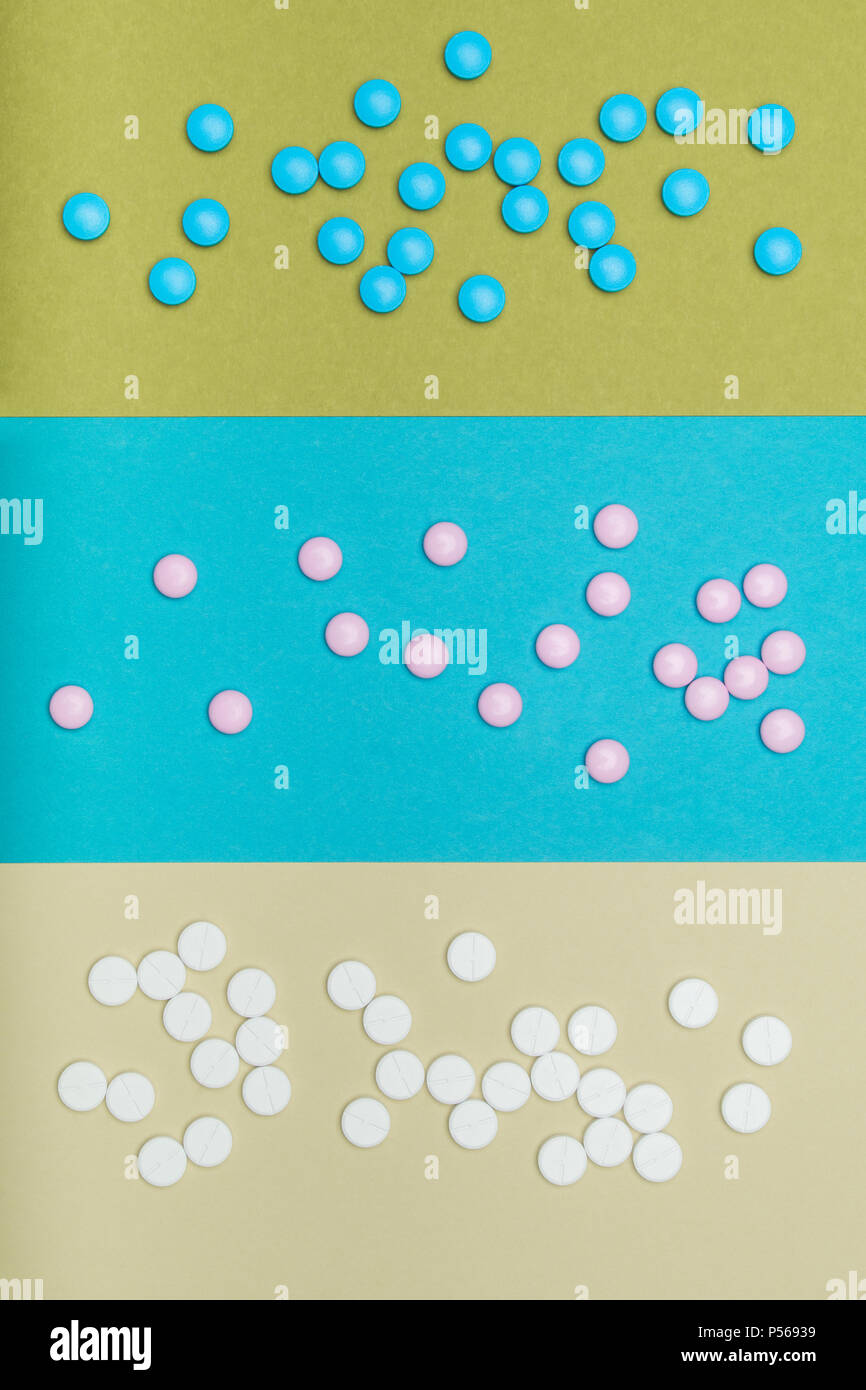 Assortment of various colourful pills isolated on pastel colored ...