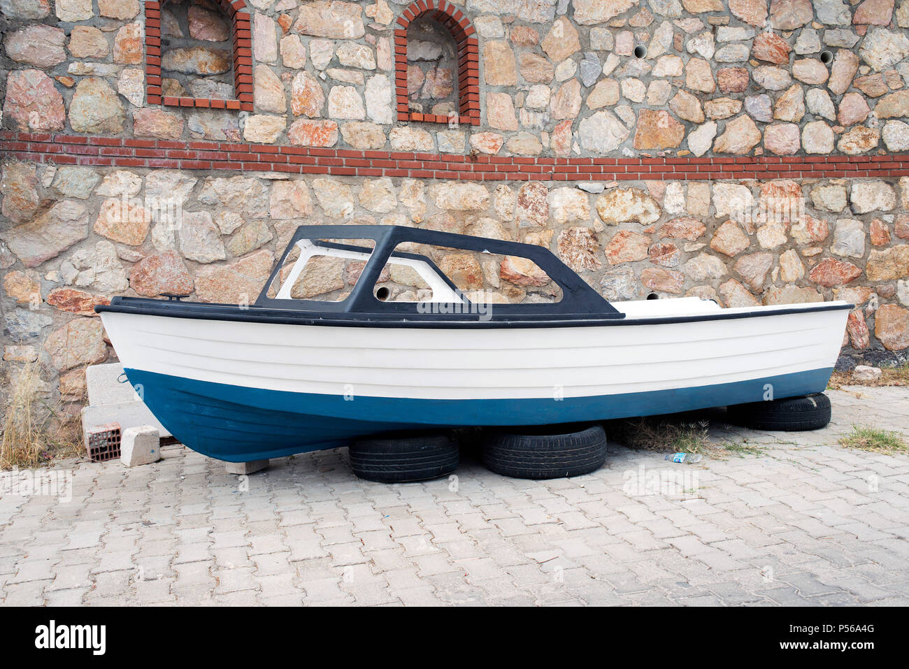 A fishing boat on the car wheels in the street in Bodrum, Turkey Stock ...