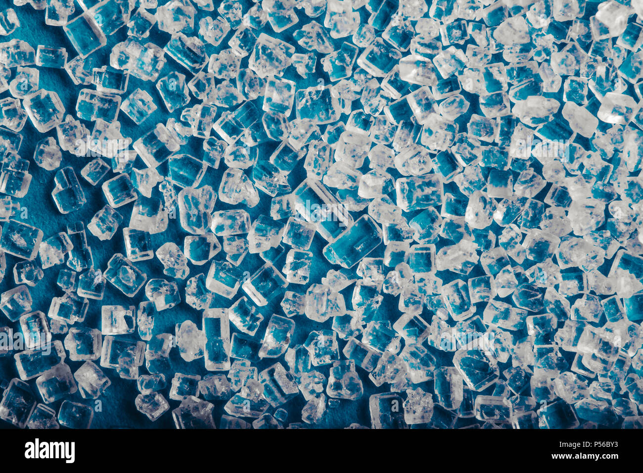 Background texture of sugar crystals on a blue background Stock Photo ...