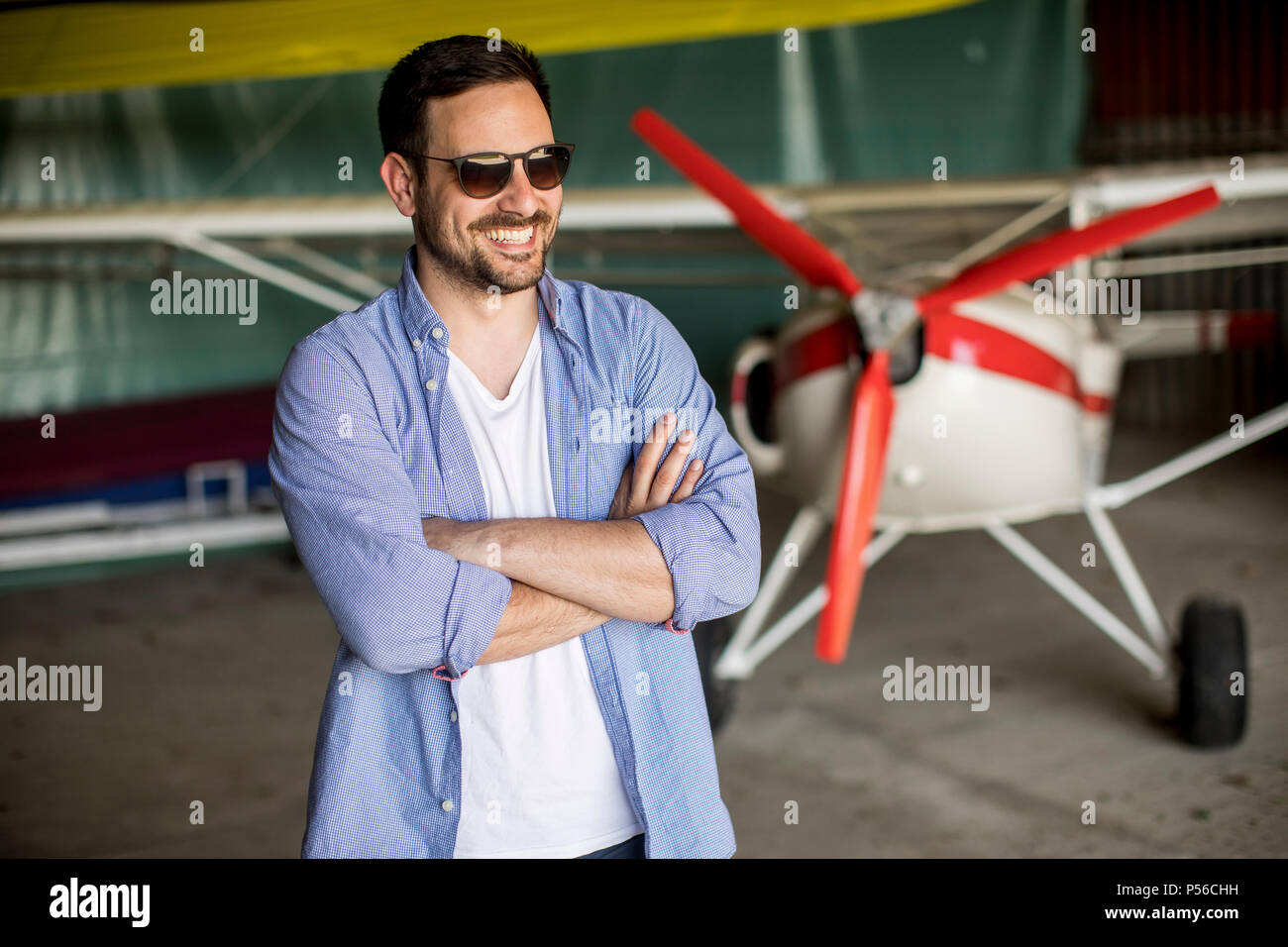Male pilot checking airplane wing hi-res stock photography and images ...
