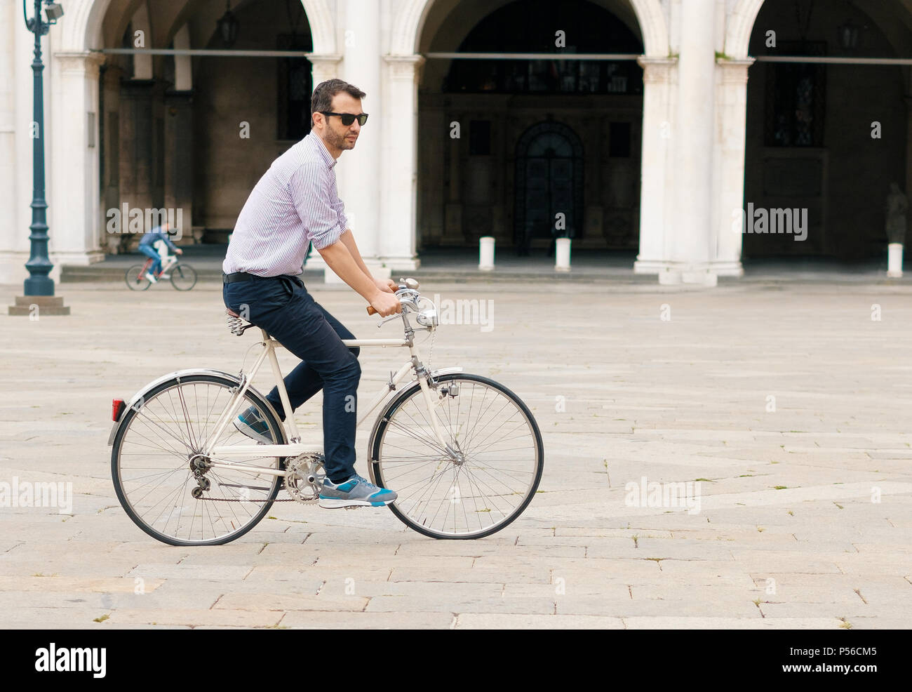 Cycling through a city hi-res stock photography and images - Alamy