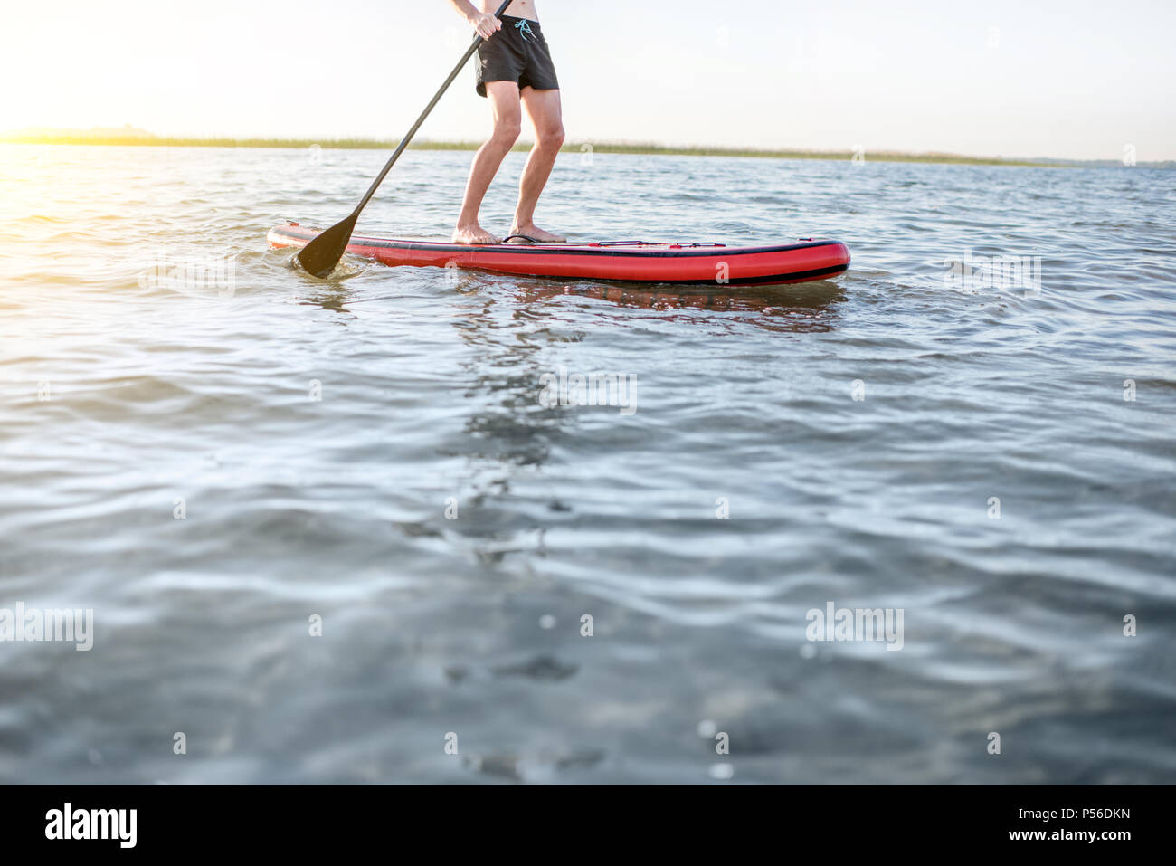 Paddleboarding man hi-res stock photography and images - Alamy