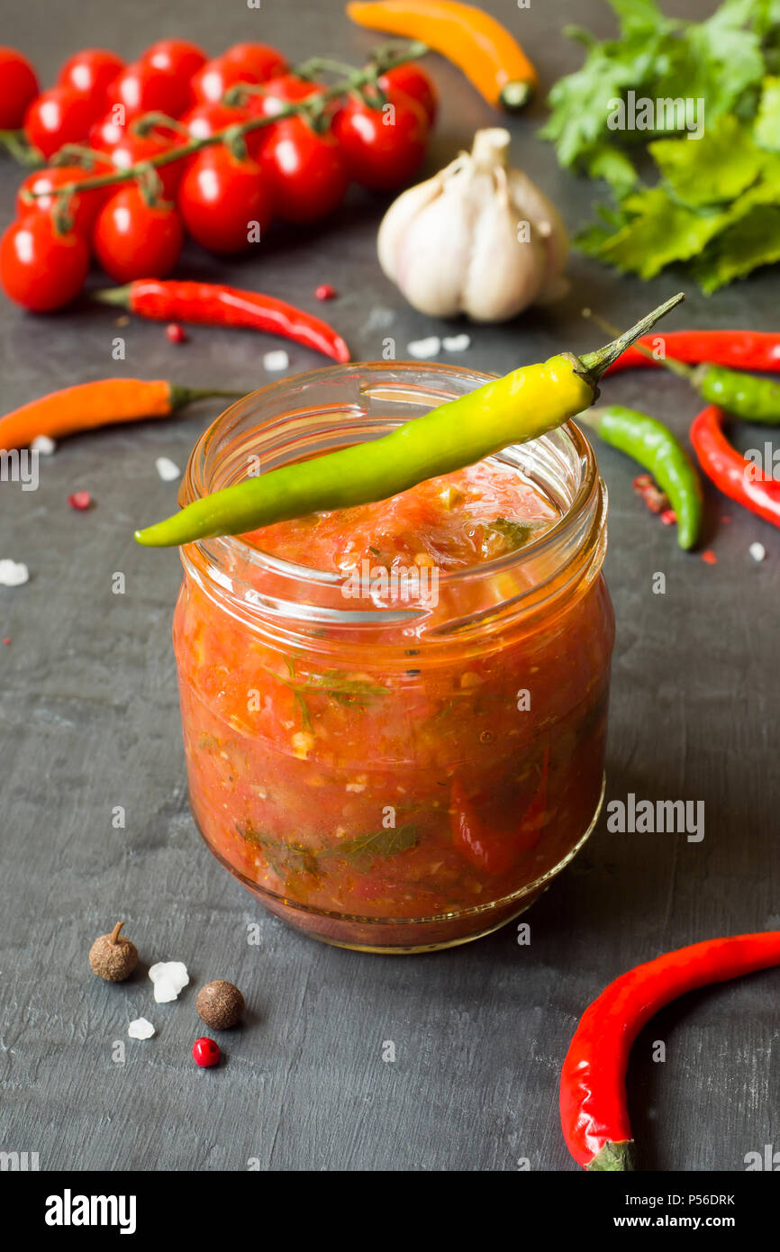 Sauce ketchup, Lecho in glass jar. Chili tomato cherry garlic and other ...