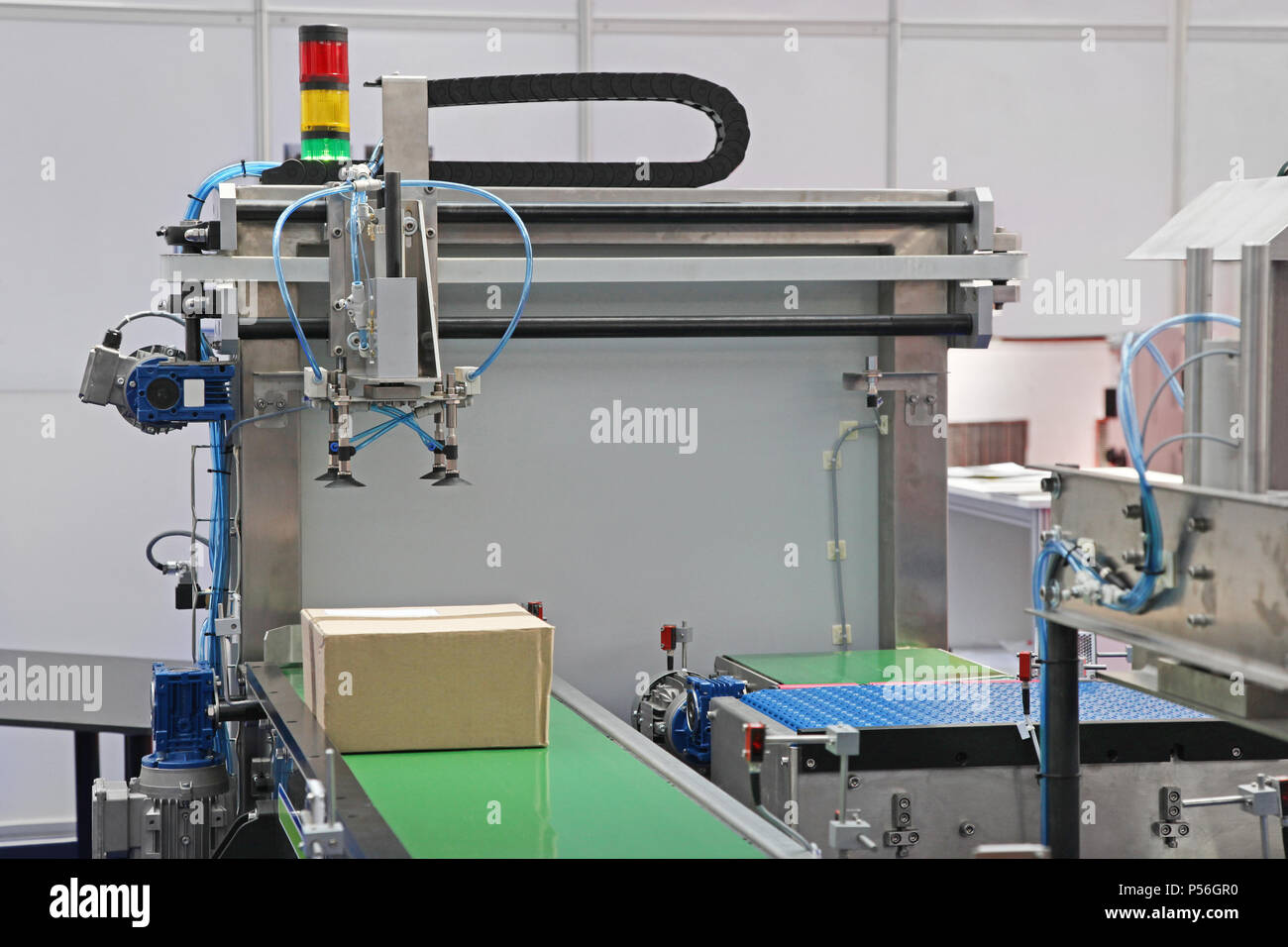 Handling Package at Automated Production Line in Factory Stock Photo ...