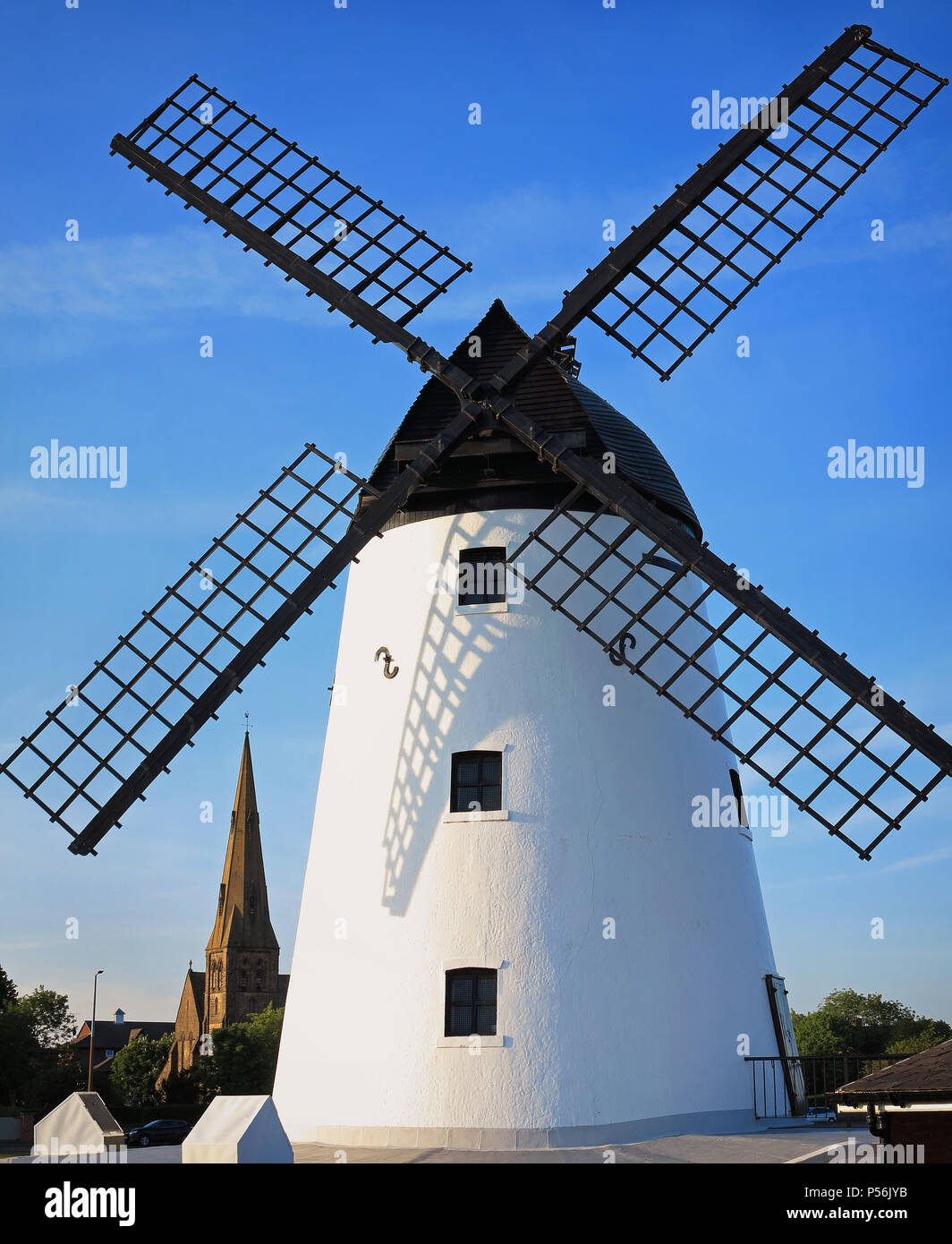 Distant windmill and church hi-res stock photography and images - Alamy