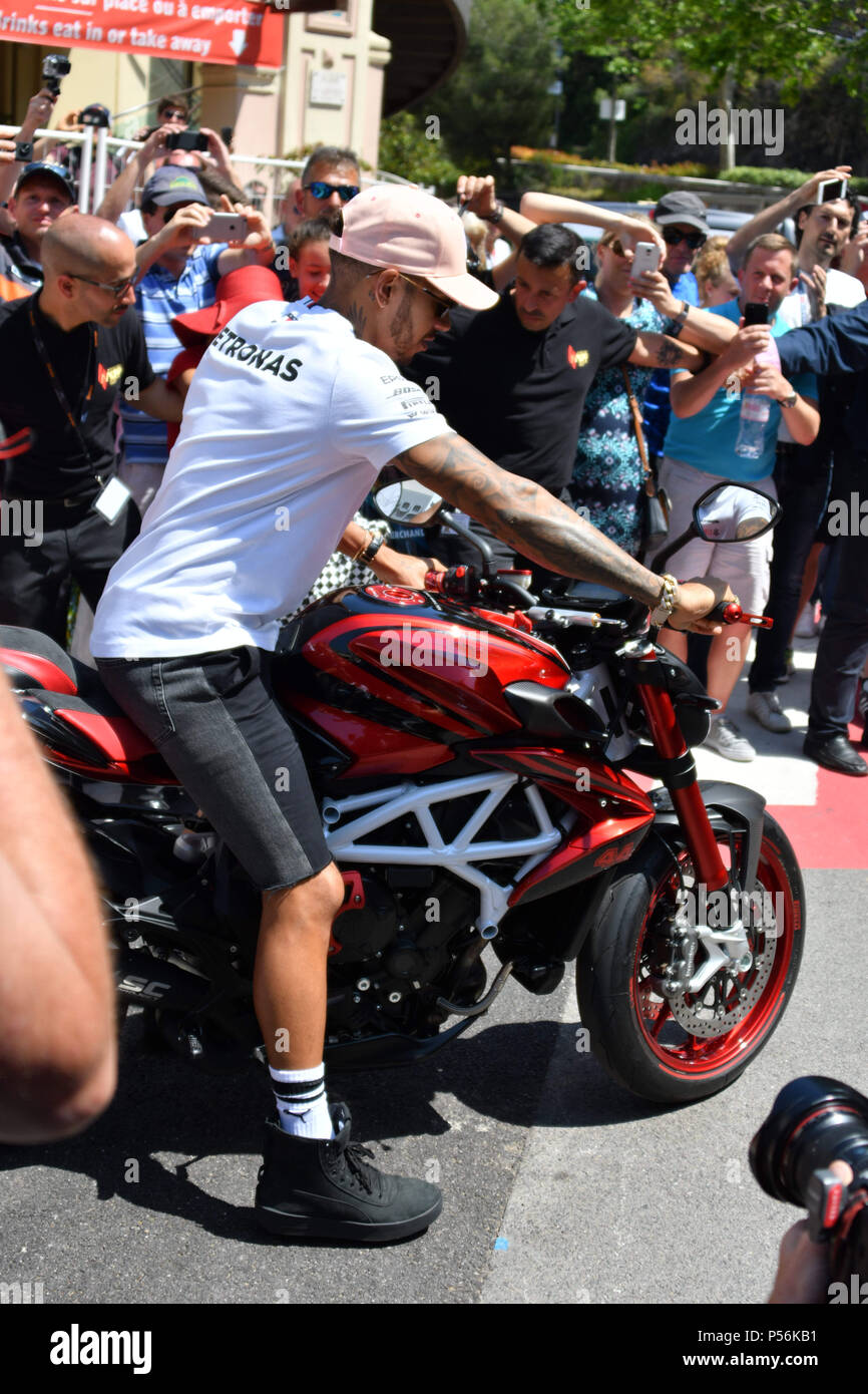 Lewis Hamilton tries out a motorcycle during the test day for the ...