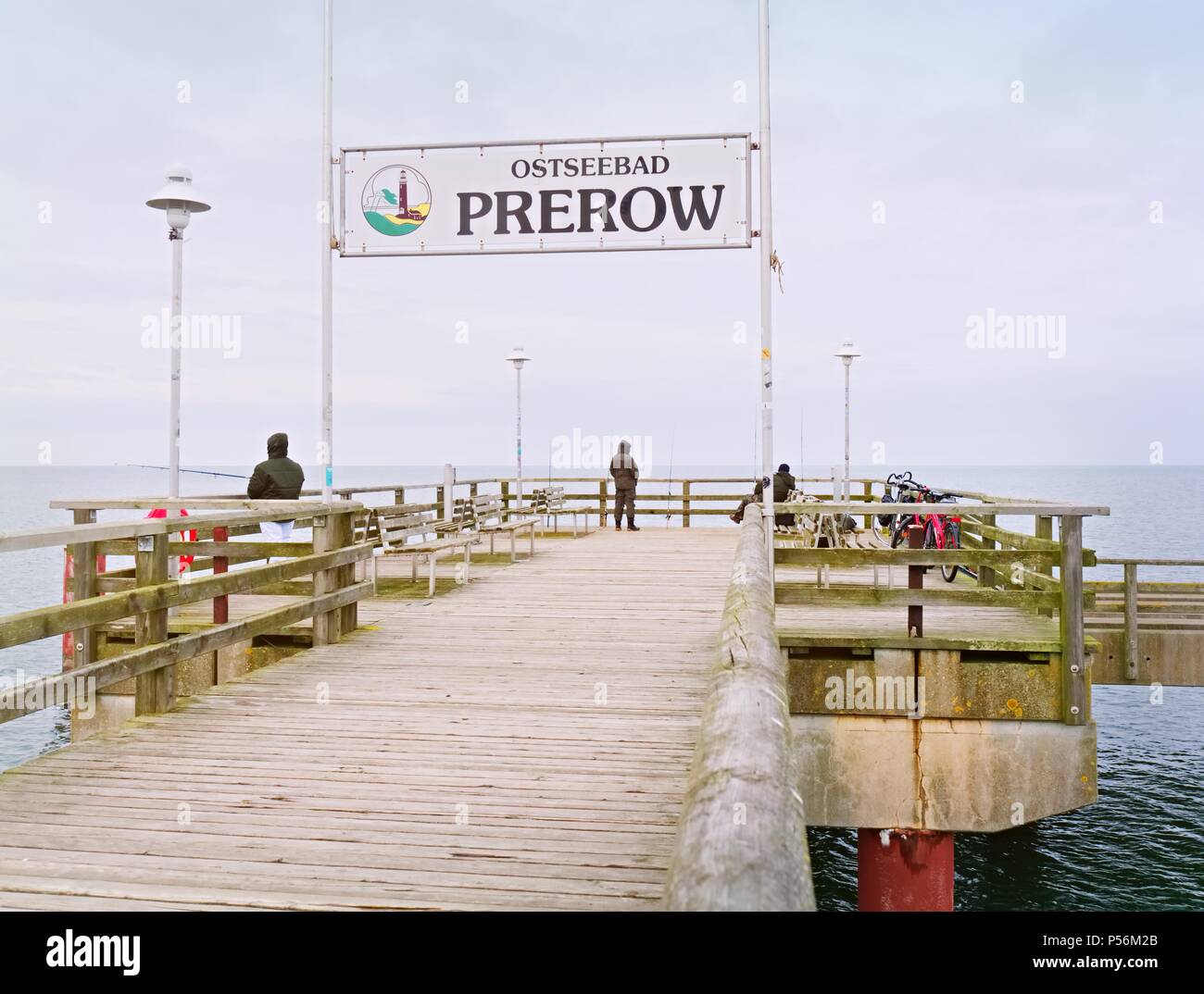Prerow Germany - June 25 2018: Fisherman on wooden sea bridge. Typical ...