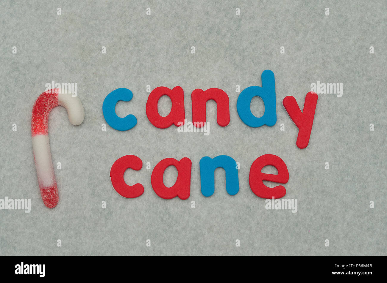 The word candy cane with a candy cane on a white background Stock Photo ...