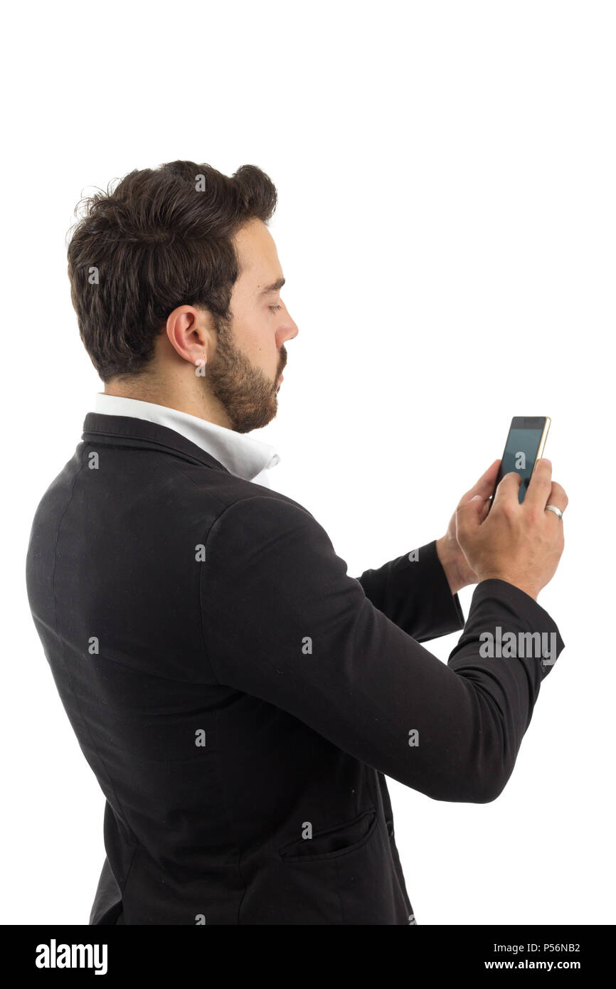 Man on his back is typing on his cell phone. Concept of technology ...