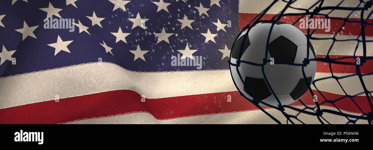 Composite image of football hitting the back of the net Stock Photo - Alamy