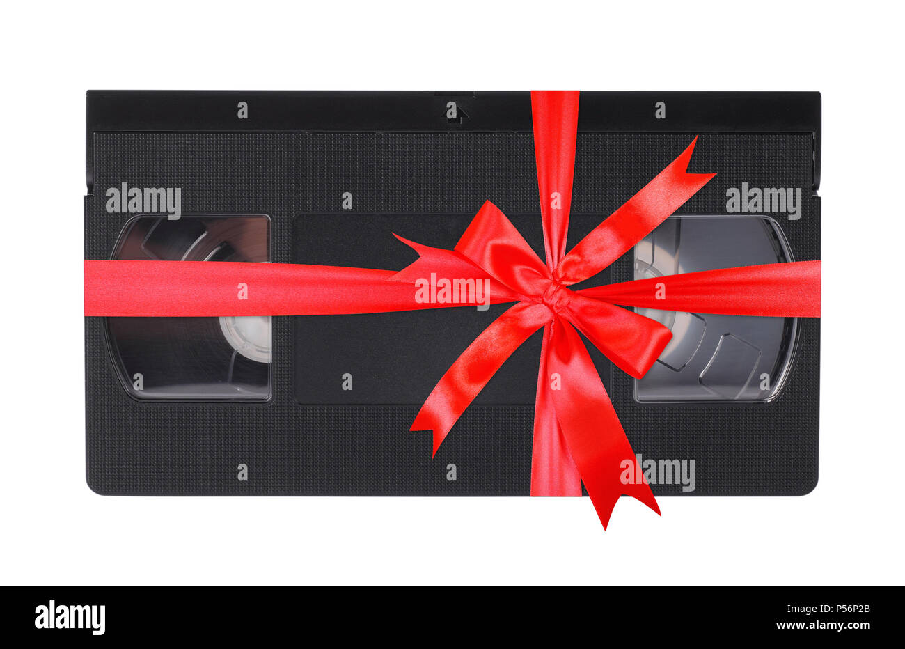 Old, obsolete video cassette vhs gift tied red bow on a white ...
