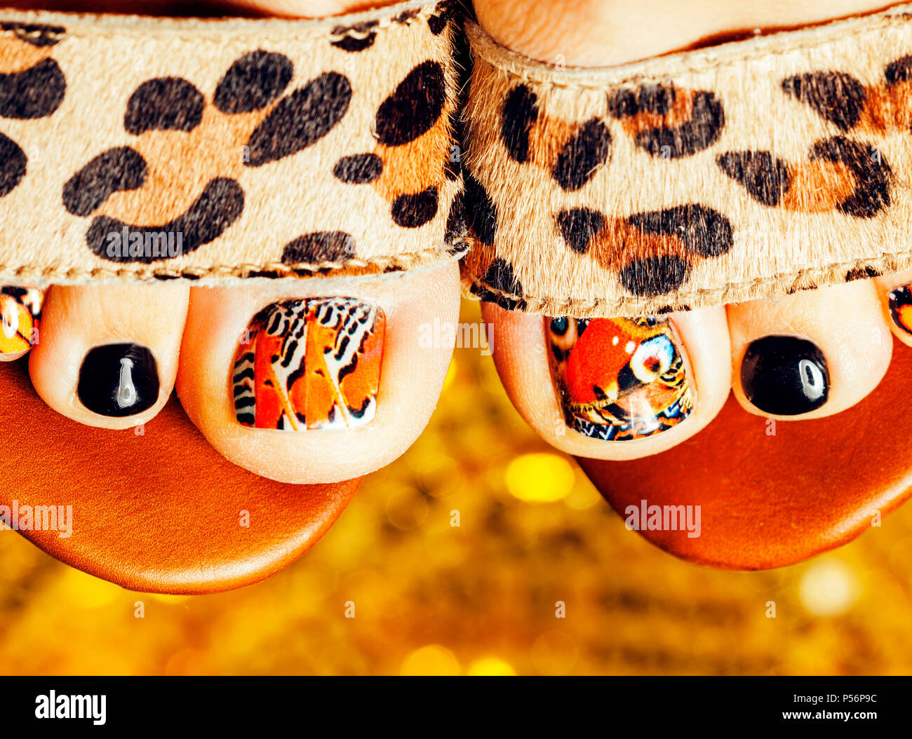 photo of pedicure like butterfly design on gold background close up ...