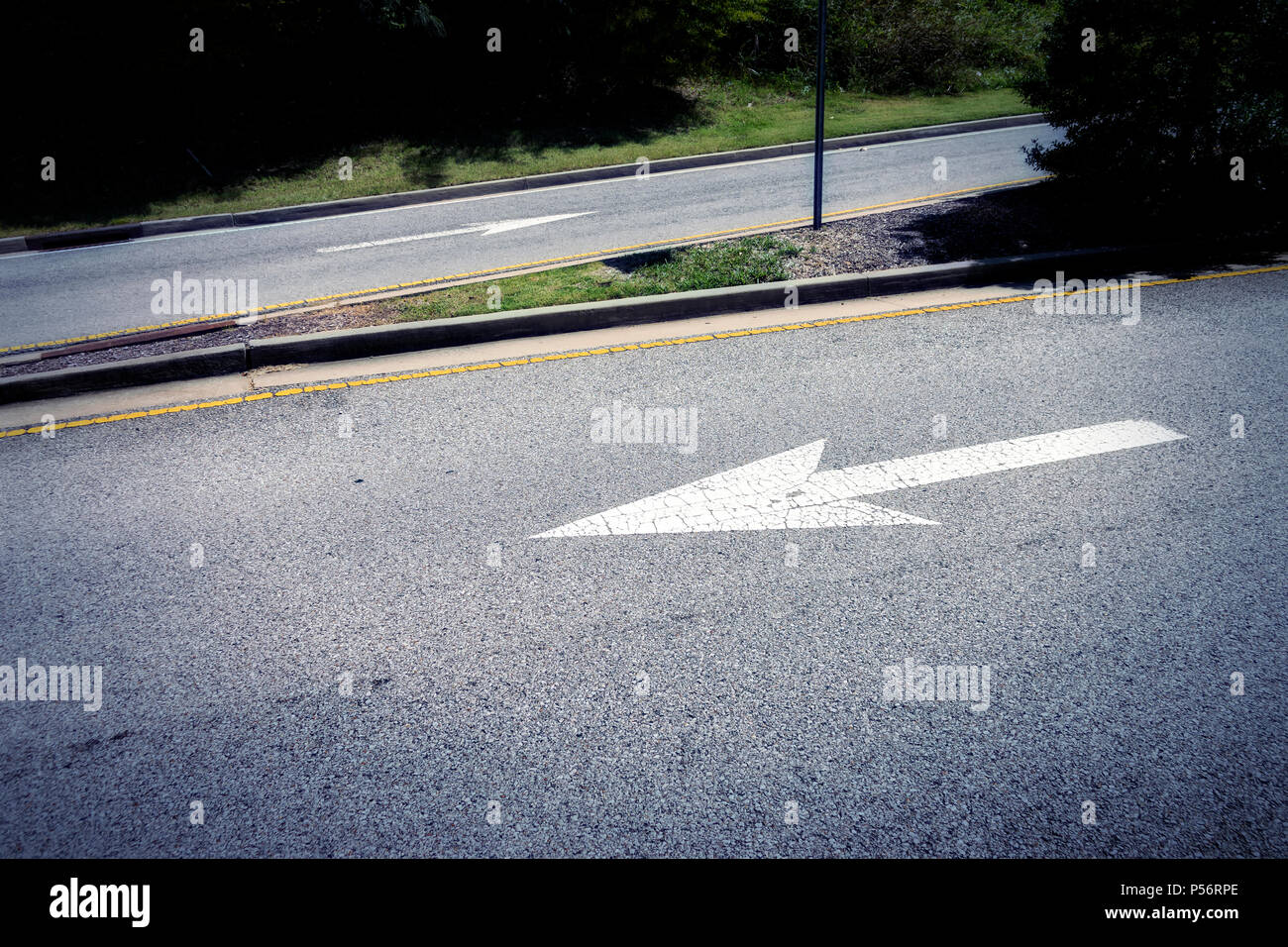 an image of an arrow sign on the road Stock Photo - Alamy