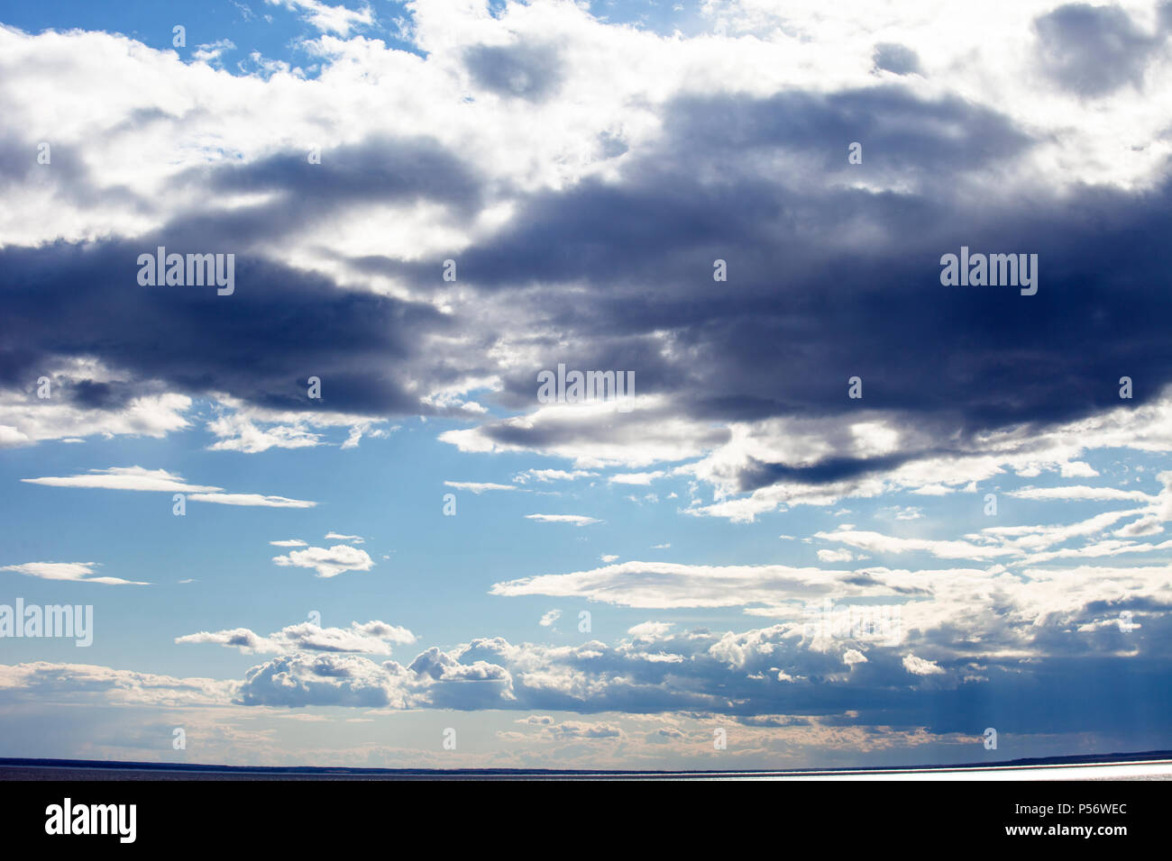 Clouds over the river. Terrible over the leaden water Stock Photo - Alamy