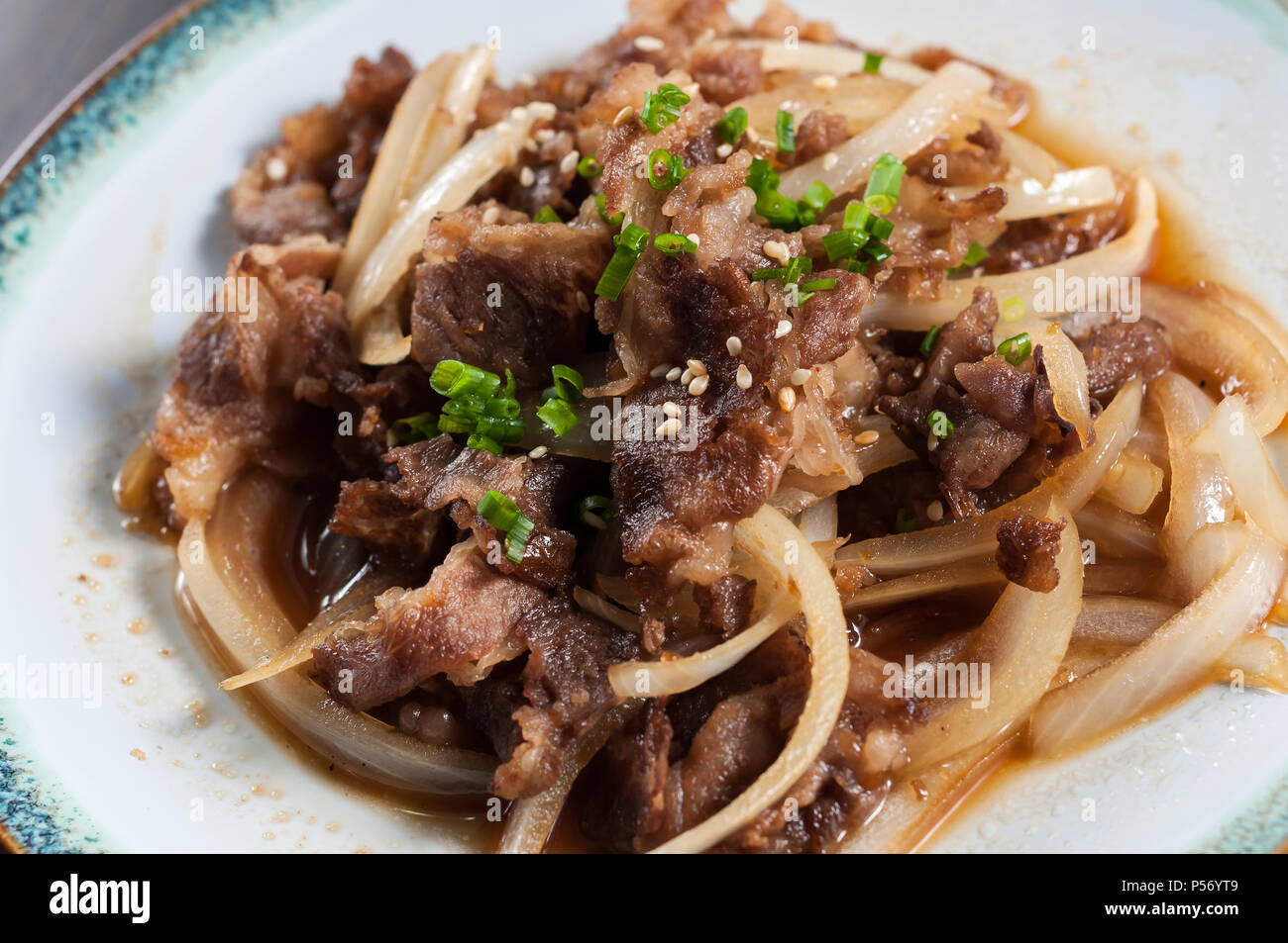 Fried beef with onion Stock Photo - Alamy