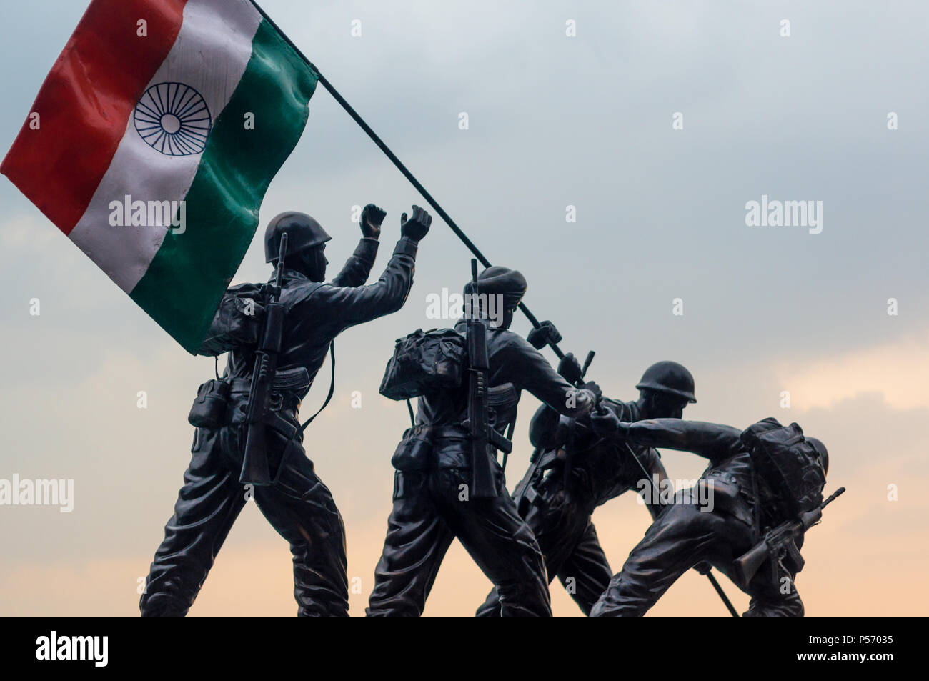 stone sculpture of indian soldiers hoisting the indian tricolor Stock ...