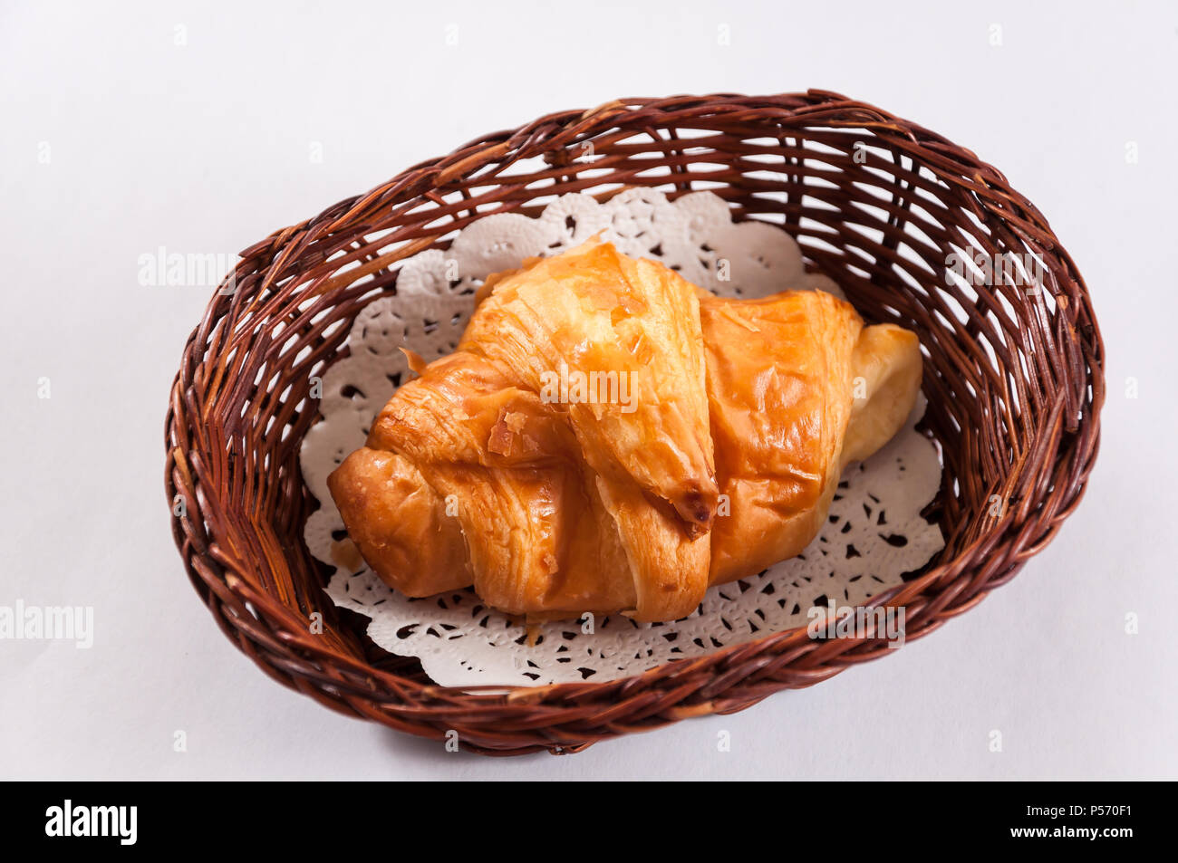 Crispy fresh croissants in a basket Stock Photo - Alamy