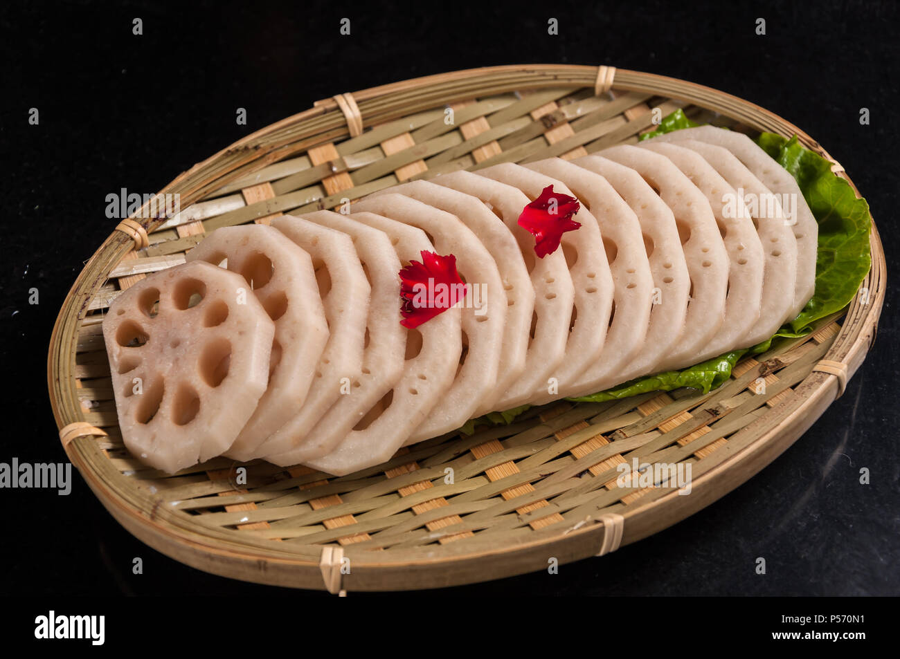 sliced lotus root on bamboo basket Stock Photo - Alamy