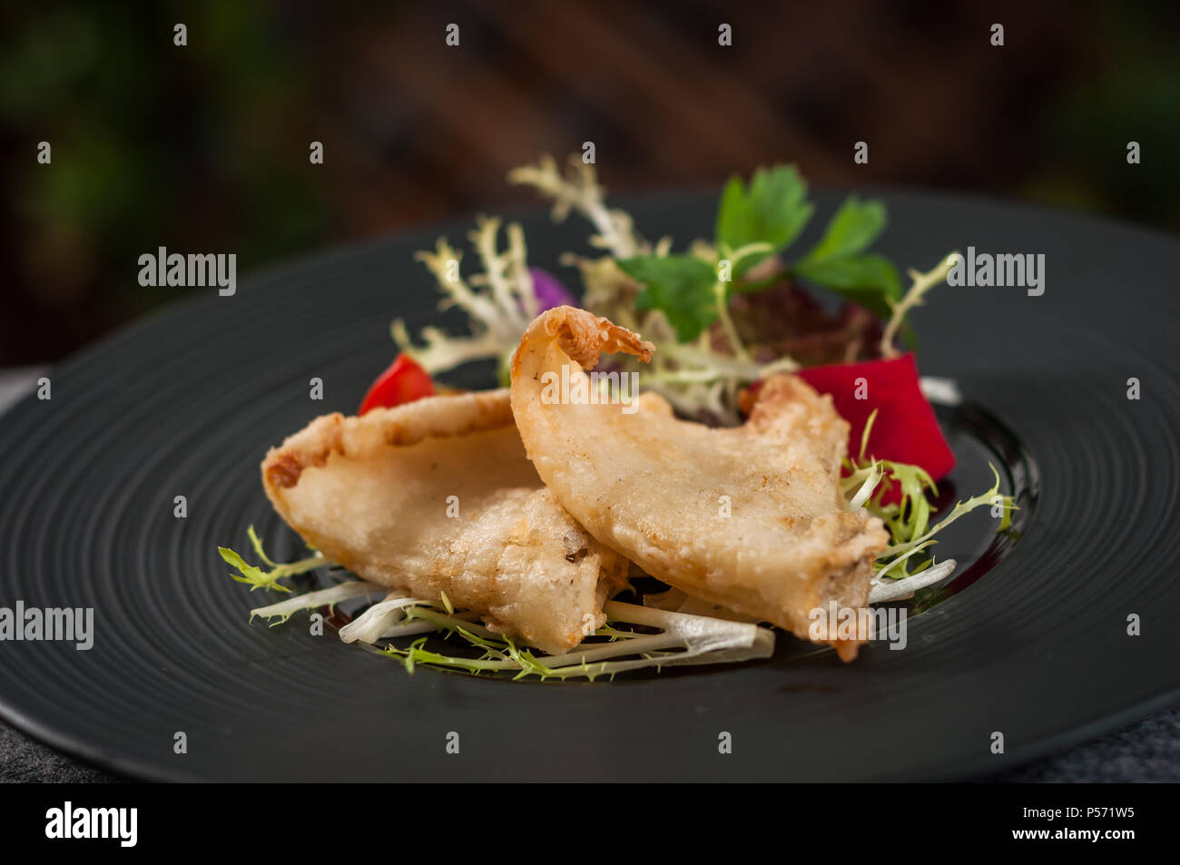Crispy shark fin in black plate Stock Photo - Alamy
