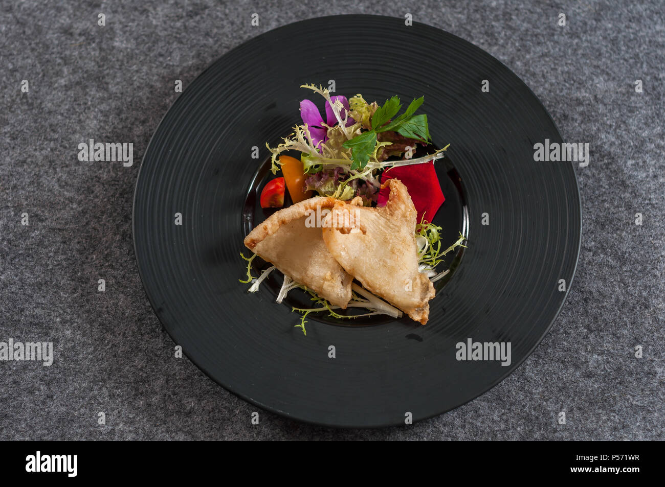 Crispy shark fin in black plate Stock Photo - Alamy