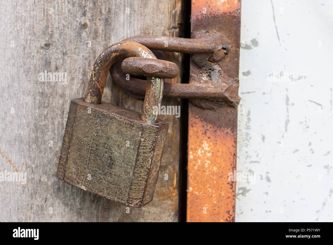 Old door lock. Metal door with closed lock Stock Photo - Alamy