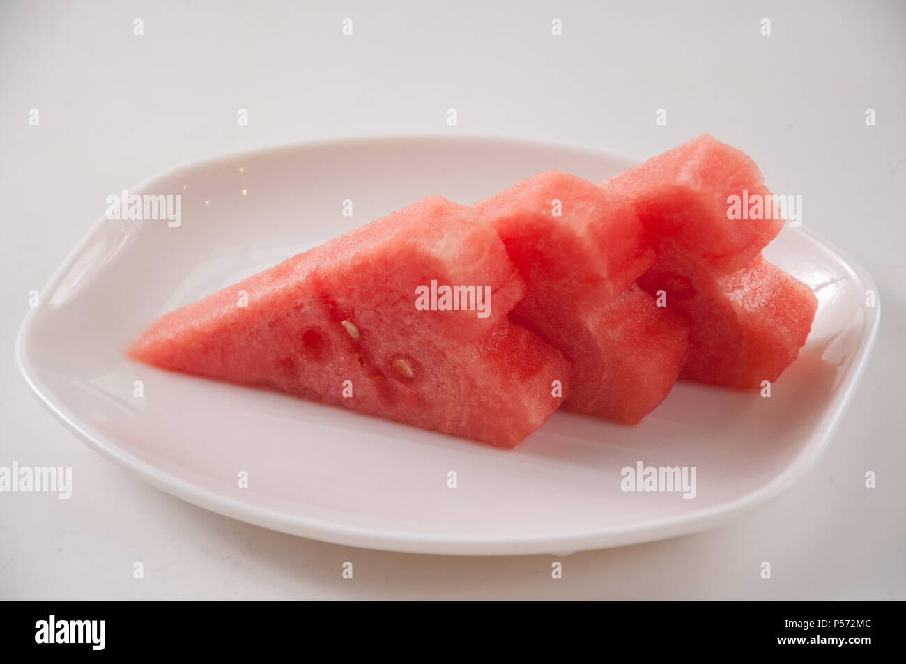 watermelon slice on white plate Stock Photo - Alamy