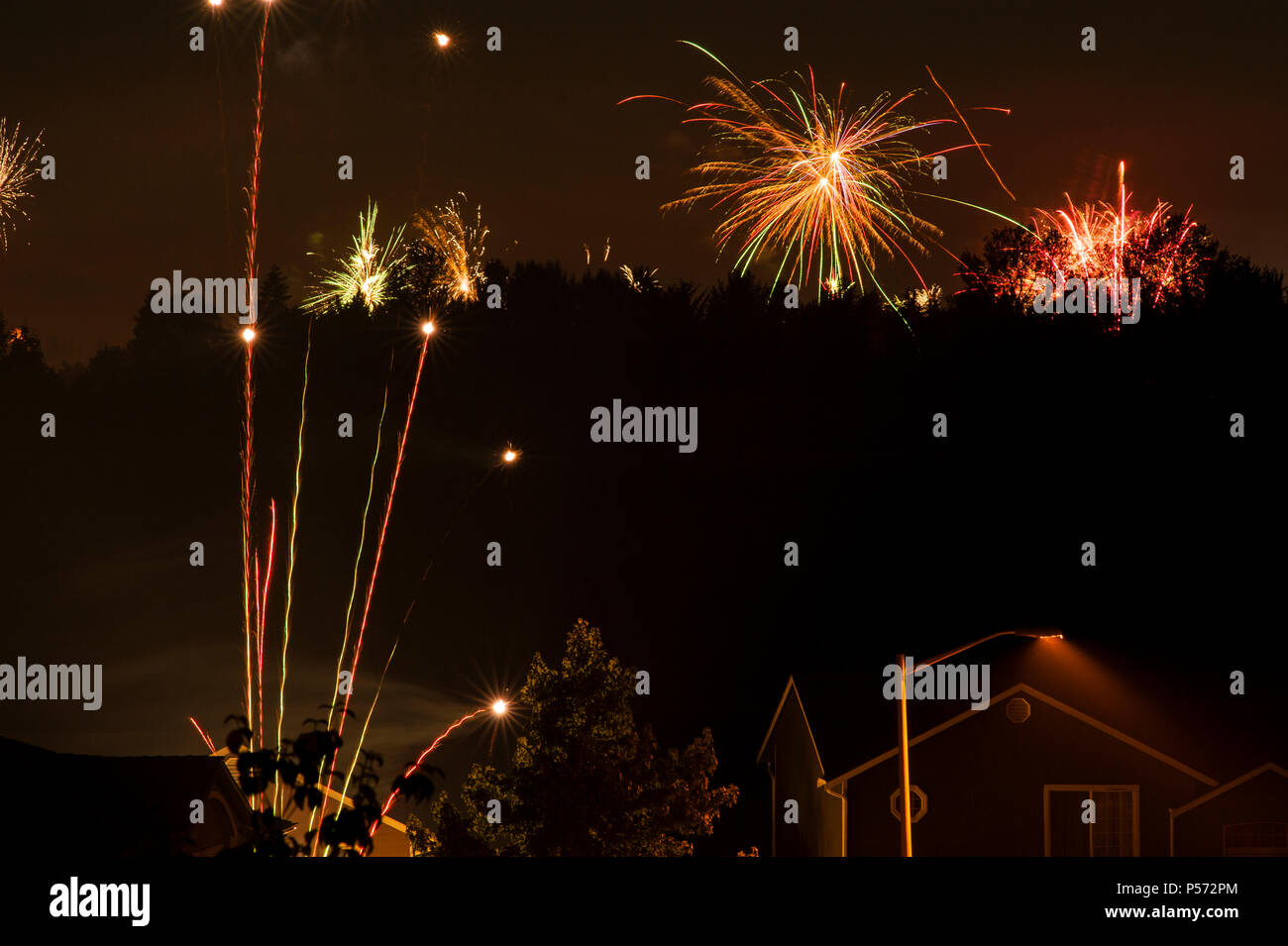 Fireworks display on the 4th of July celebration in a neighborhood that ...