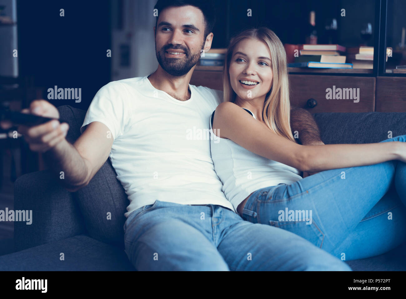 Man watching tv switching channels hi-res stock photography and images ...