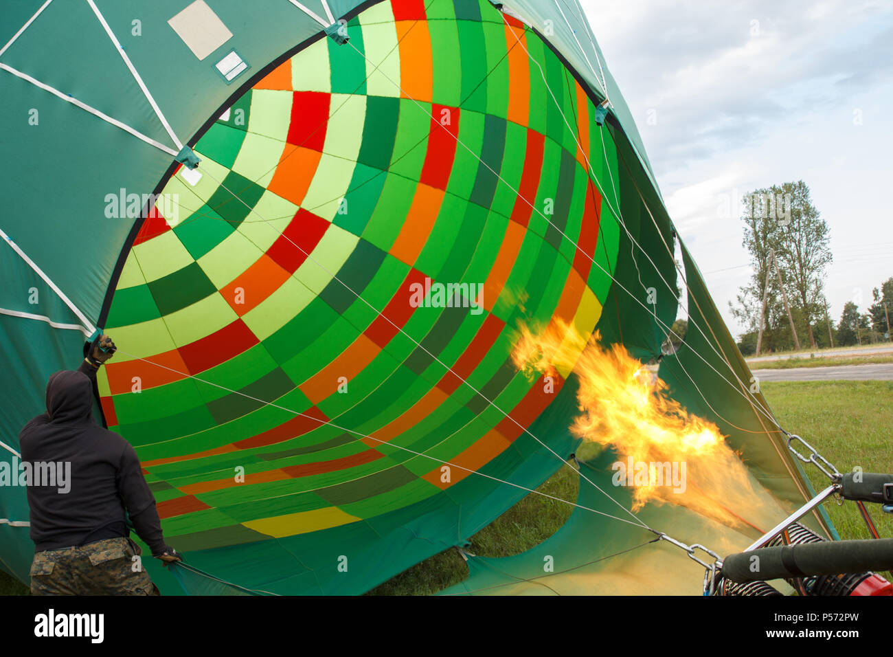 hot air balloon preparing for flight, heating air with fire Stock Photo ...