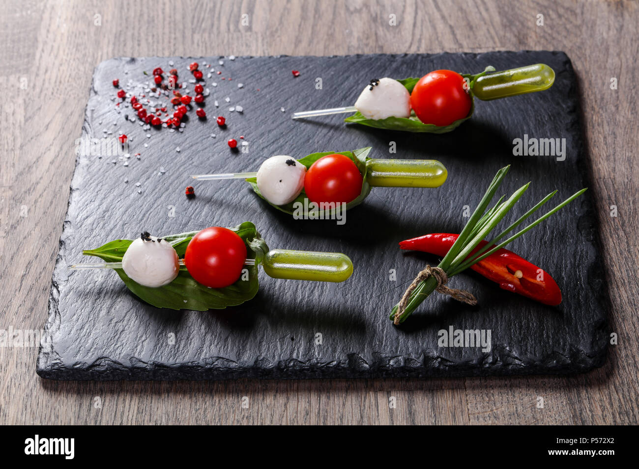 Canape caprese with olive oil Stock Photo - Alamy