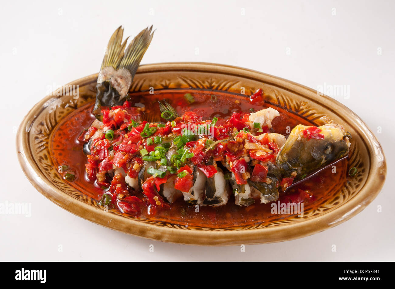 steamed yellow catfish with diced hot red pepper Stock Photo - Alamy