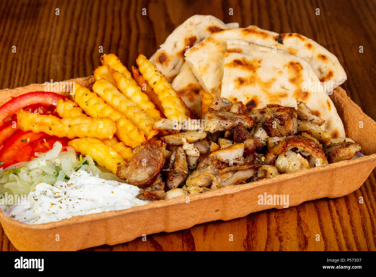 Gyros with meat, potato and sauce Stock Photo - Alamy