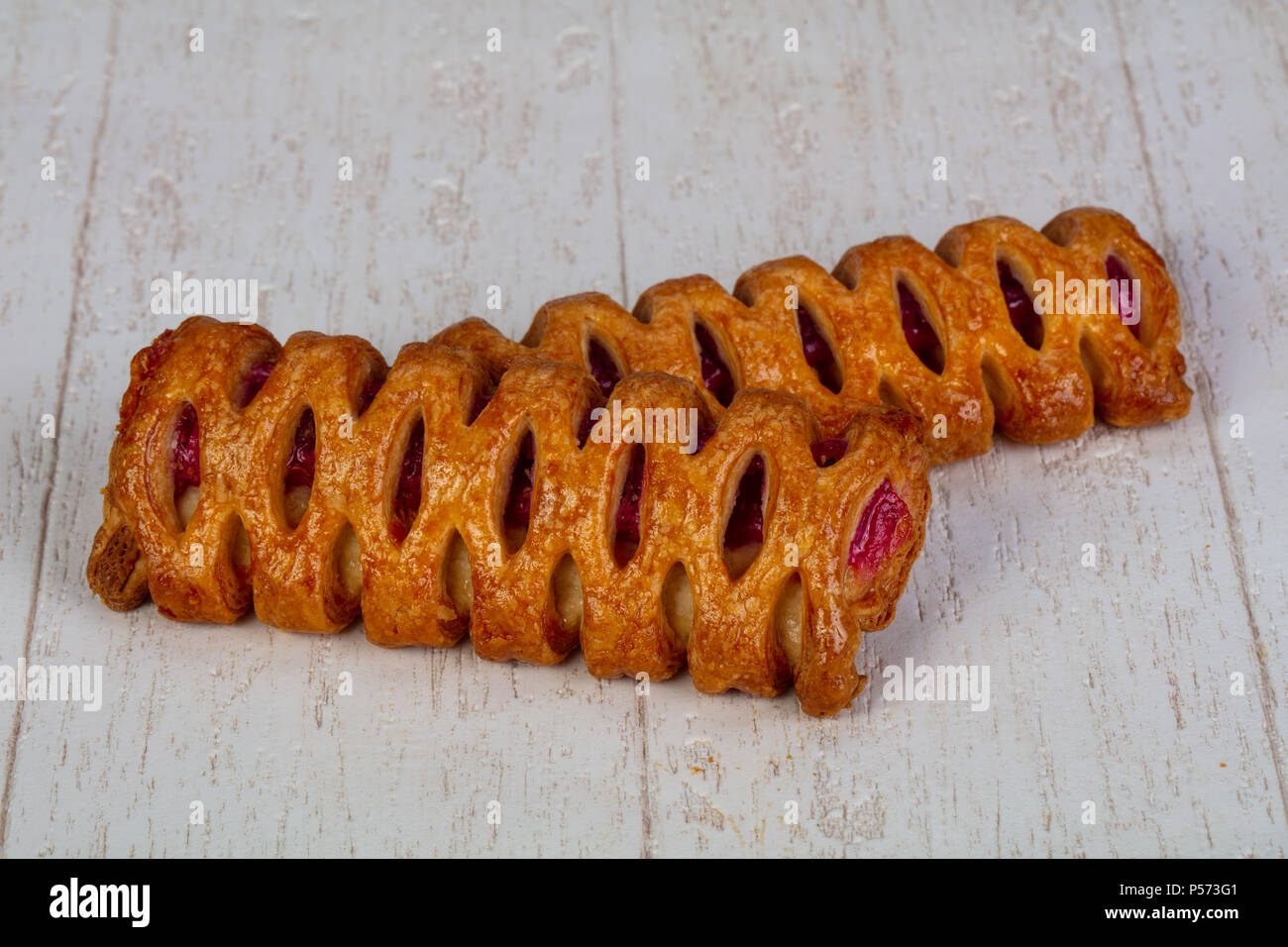 Delicious puff pastry strudel with jam Stock Photo - Alamy