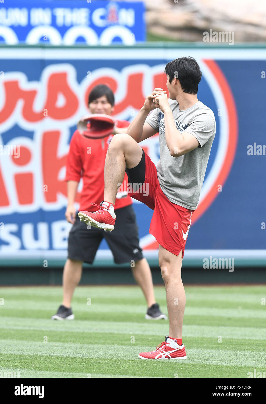 Shohei Ohtani of the Los Angeles Angels throws a ball with his left ...