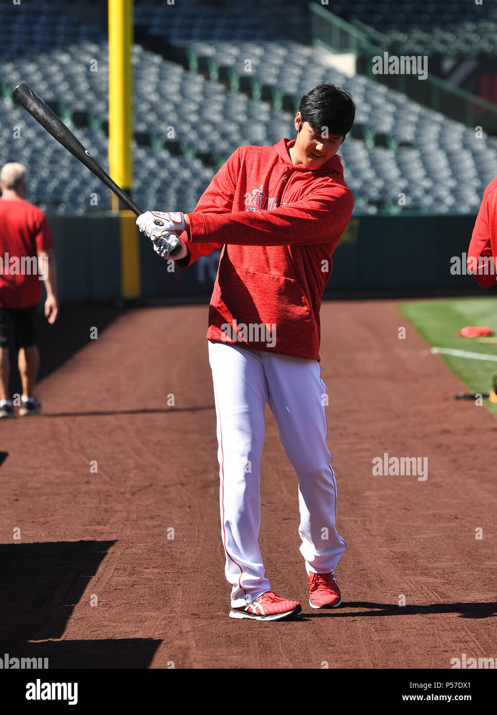 Shohei Ohtani of the Los Angeles Angels takes a practice swing before ...