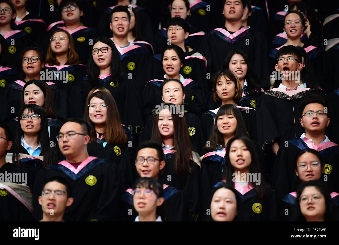 Students attend graduation ceremony in hi-res stock photography and ...