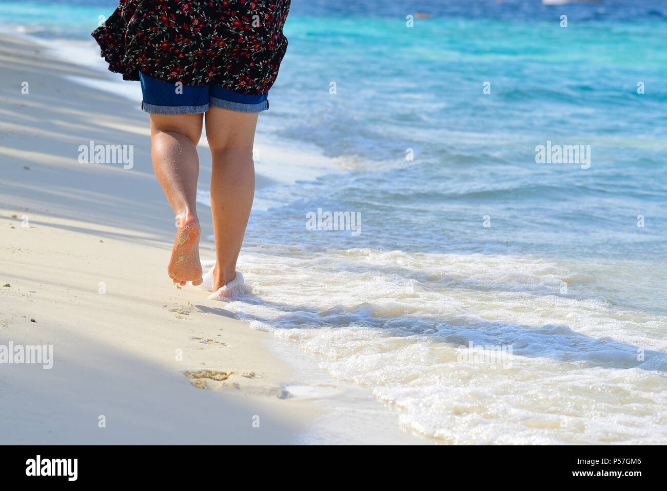 Woman walk on the beach with beautiful sea Stock Photo - Alamy